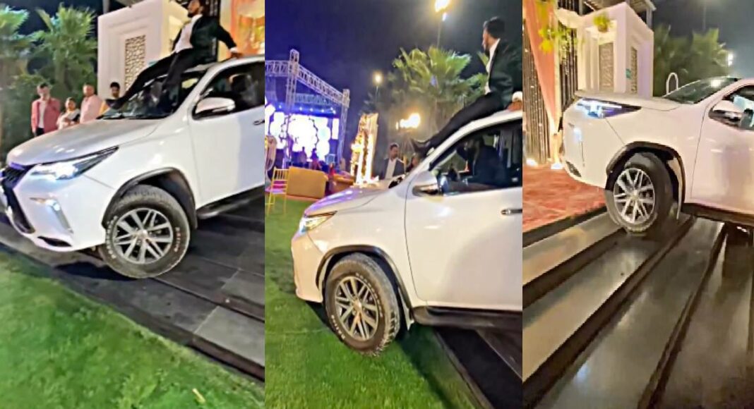 Man Dancing on Toyota Fortuner's Roof as it Goes Down Stairs