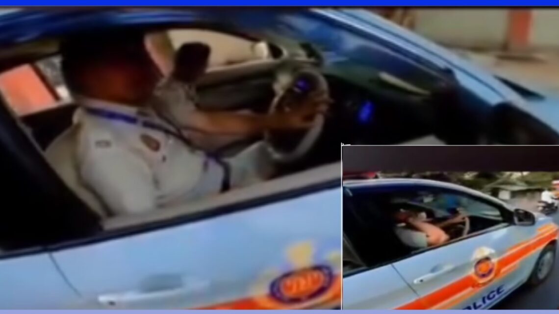 Biker Catches Cop Driving without Seatbelt, Talking on Phone